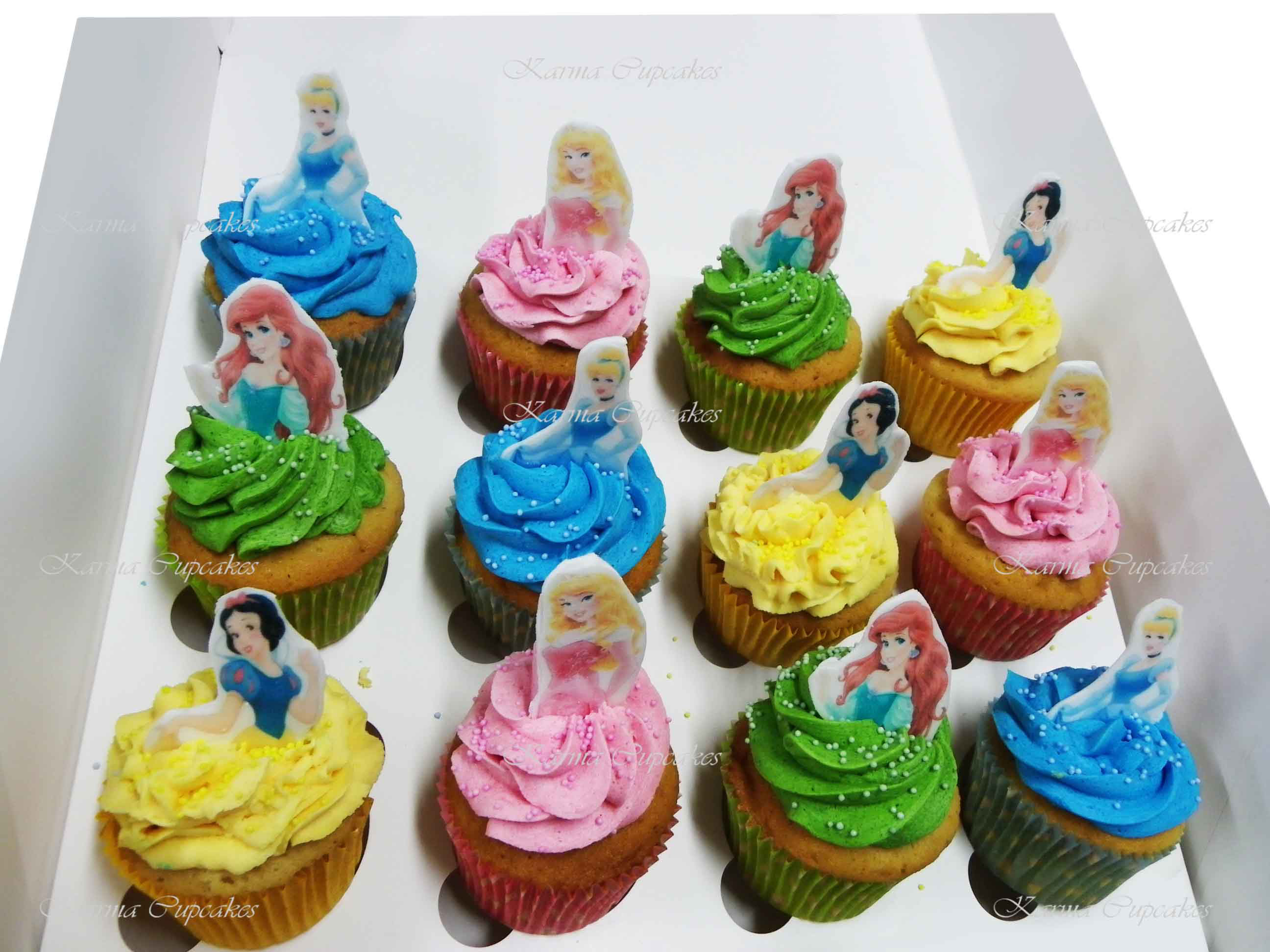 Disney Themed cupcakes topped with edible images of Princesses
